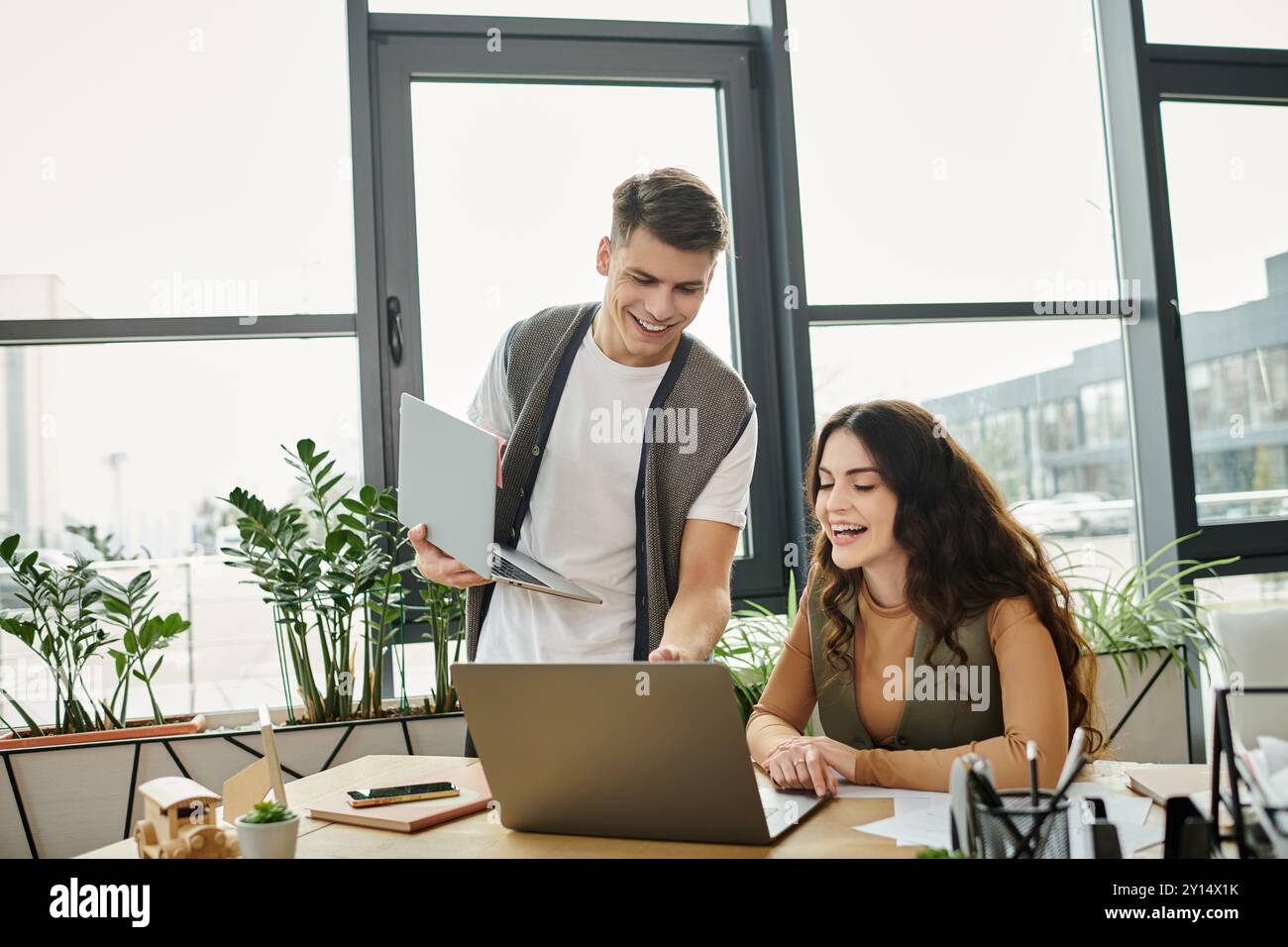 Two colleagues engage in conversation hi-res stock photography and ...