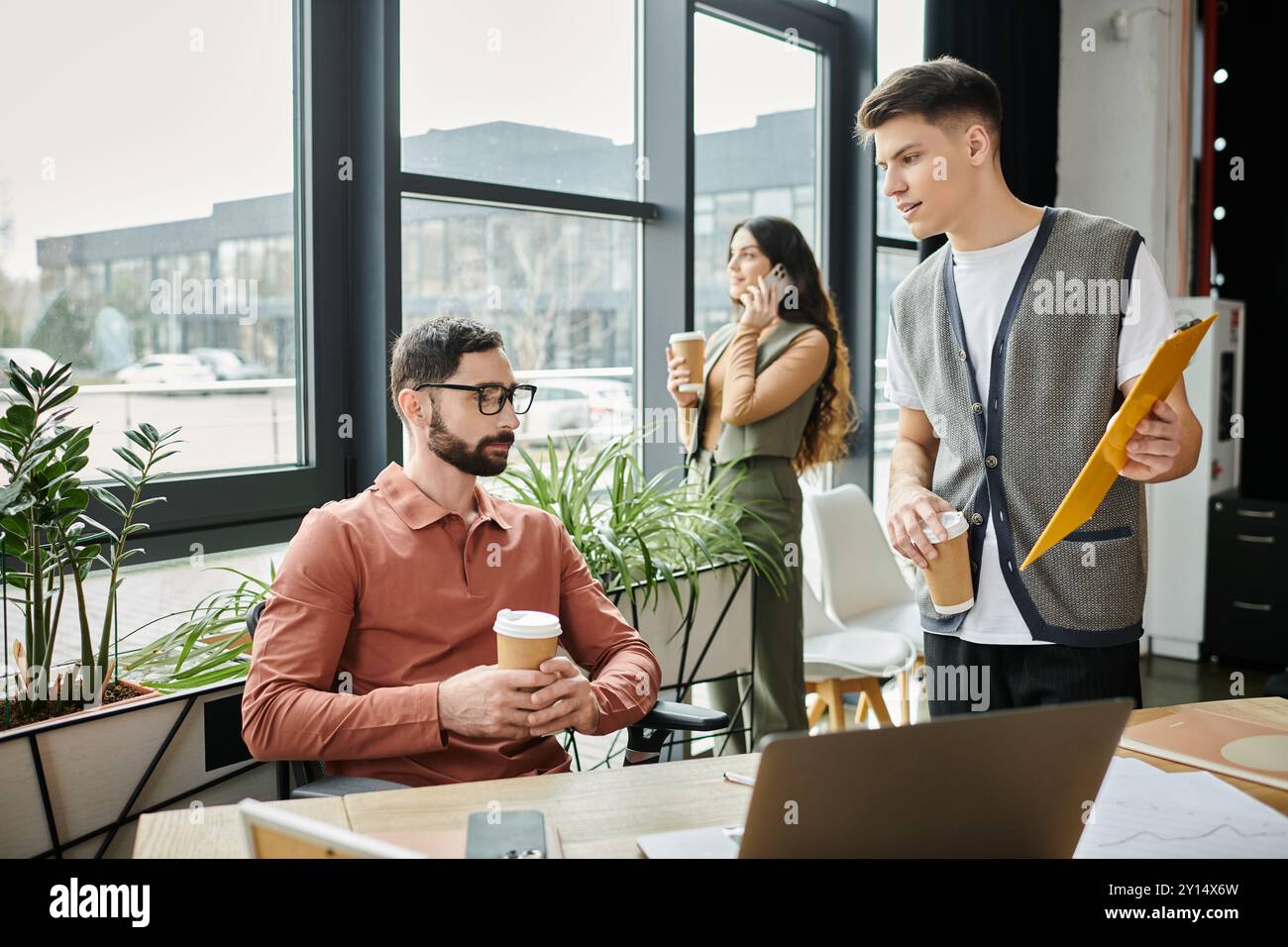 Stylish colleagues engage in hi-res stock photography and images - Alamy