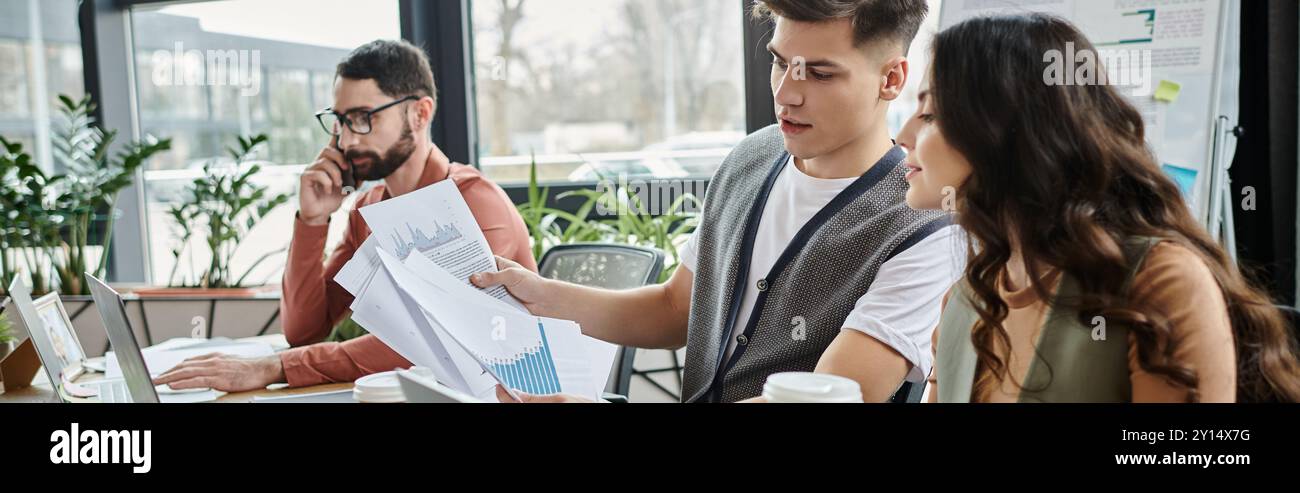 Professionals engaging in discussion during work in office Stock Photo ...