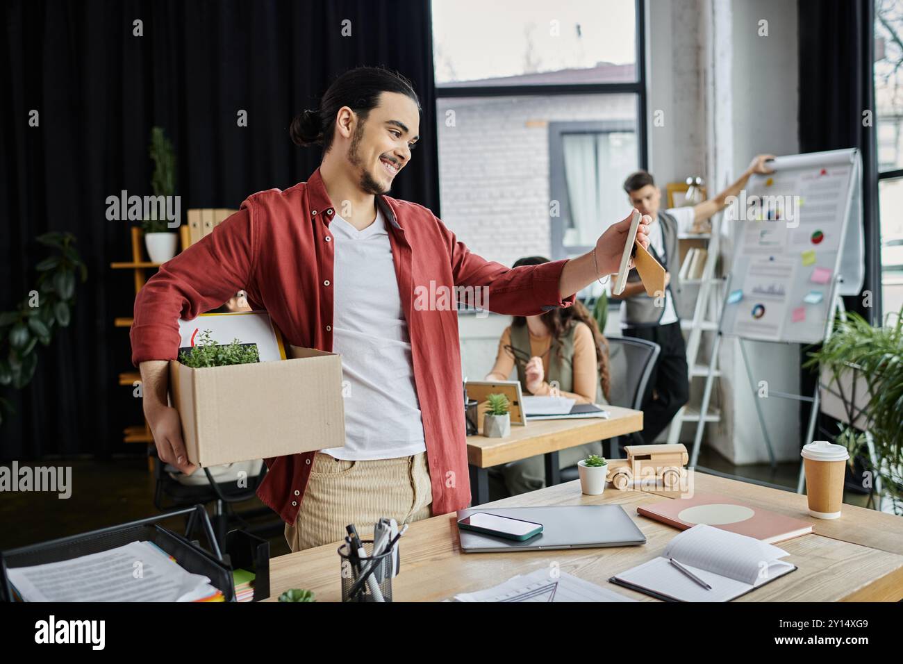 Team members during an emotional transition at work Stock Photo - Alamy