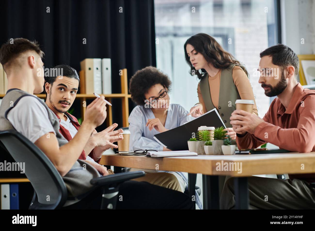 Professionals engage in a serious discussion about their work Stock ...
