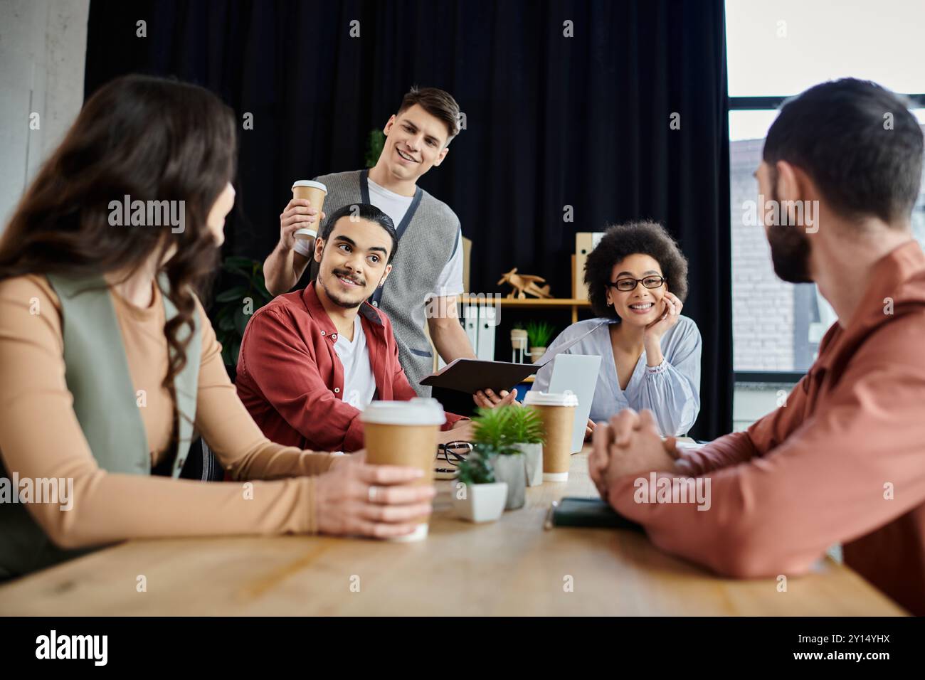 Diverse professionals engage in teamwork hi-res stock photography and ...