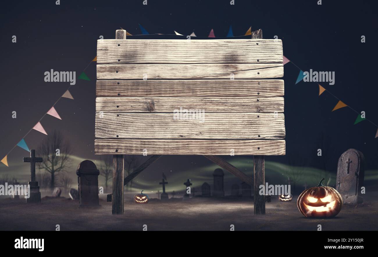 Old wooden sign and scary Halloween pumpkins in a graveyard, blank copy ...