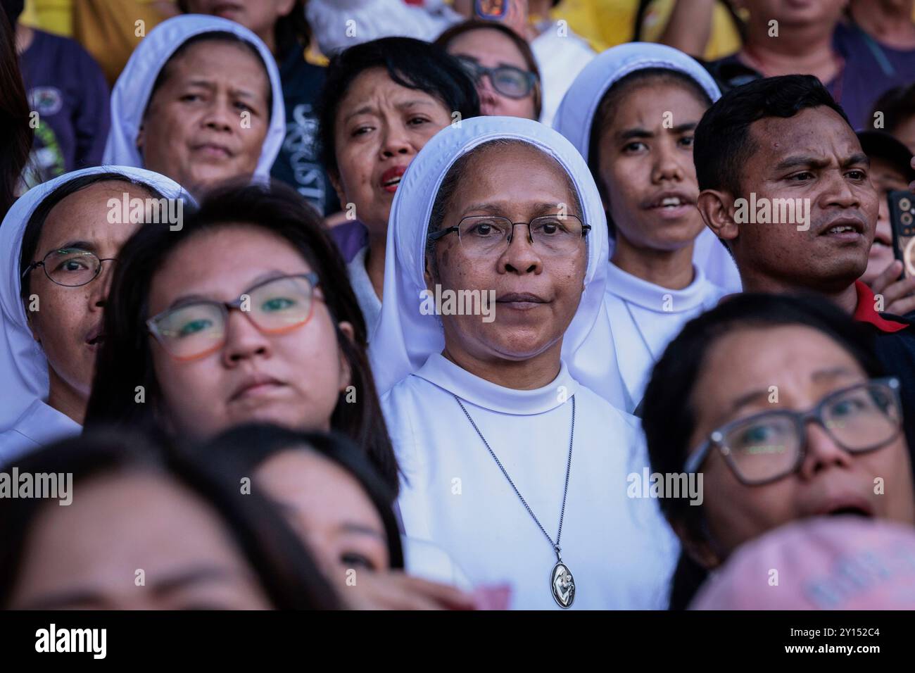 People wait for the arrival of Pope Francis during a holy mass at the ...