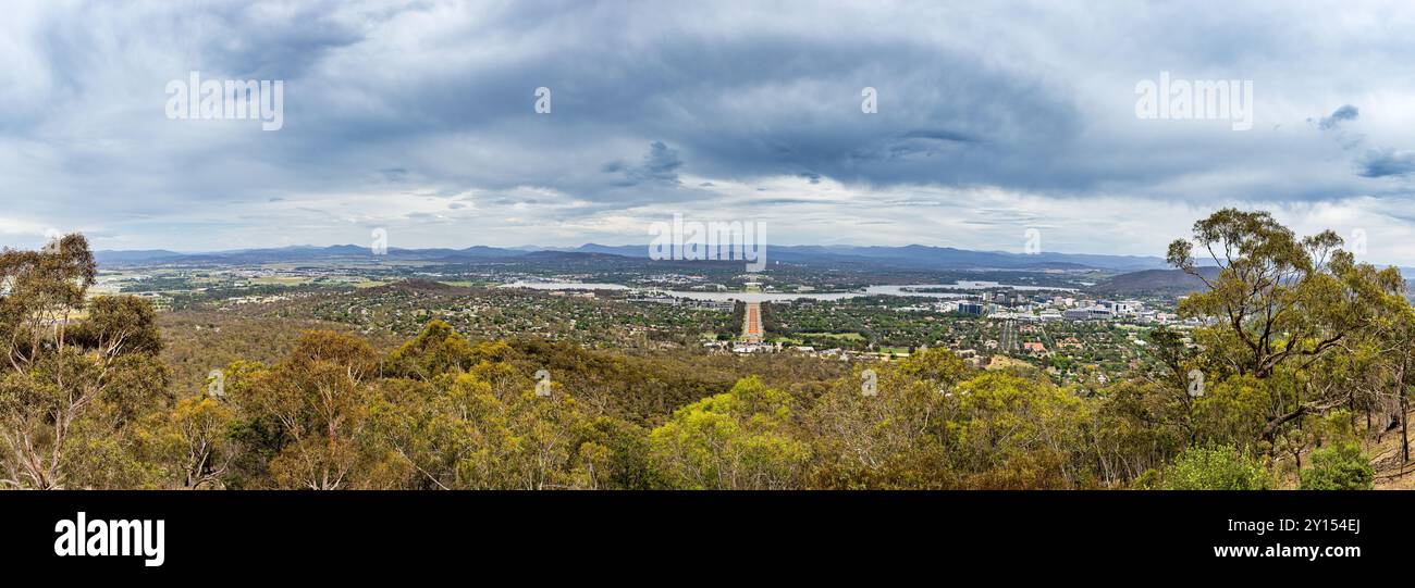 A wide view captures the lush landscape of Canberra, featuring the city ...
