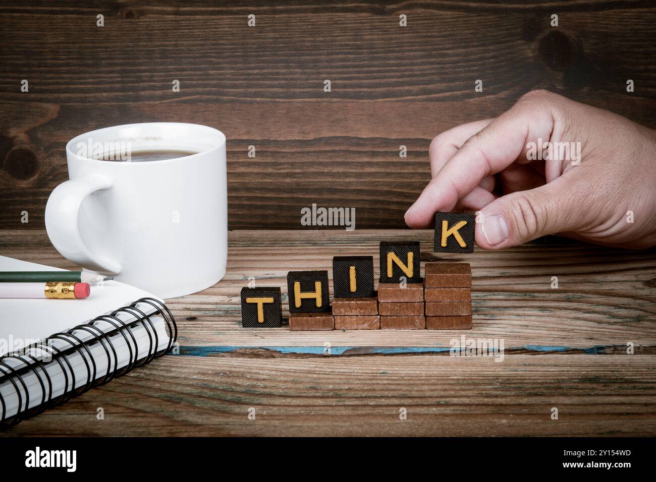 THINK. Old letter tiles on wooden steps, development concept Stock ...