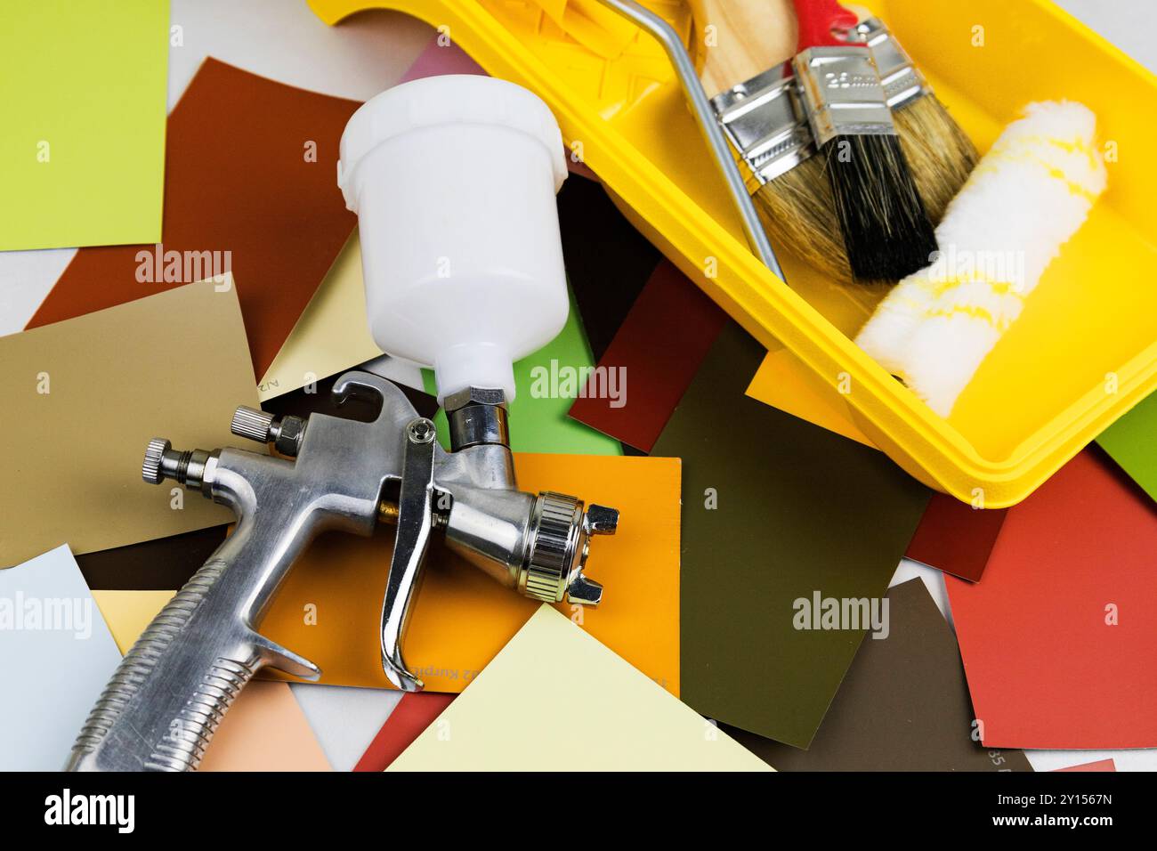 Paint spray gun at work at the workplace in the workshop. Paint Brush ...