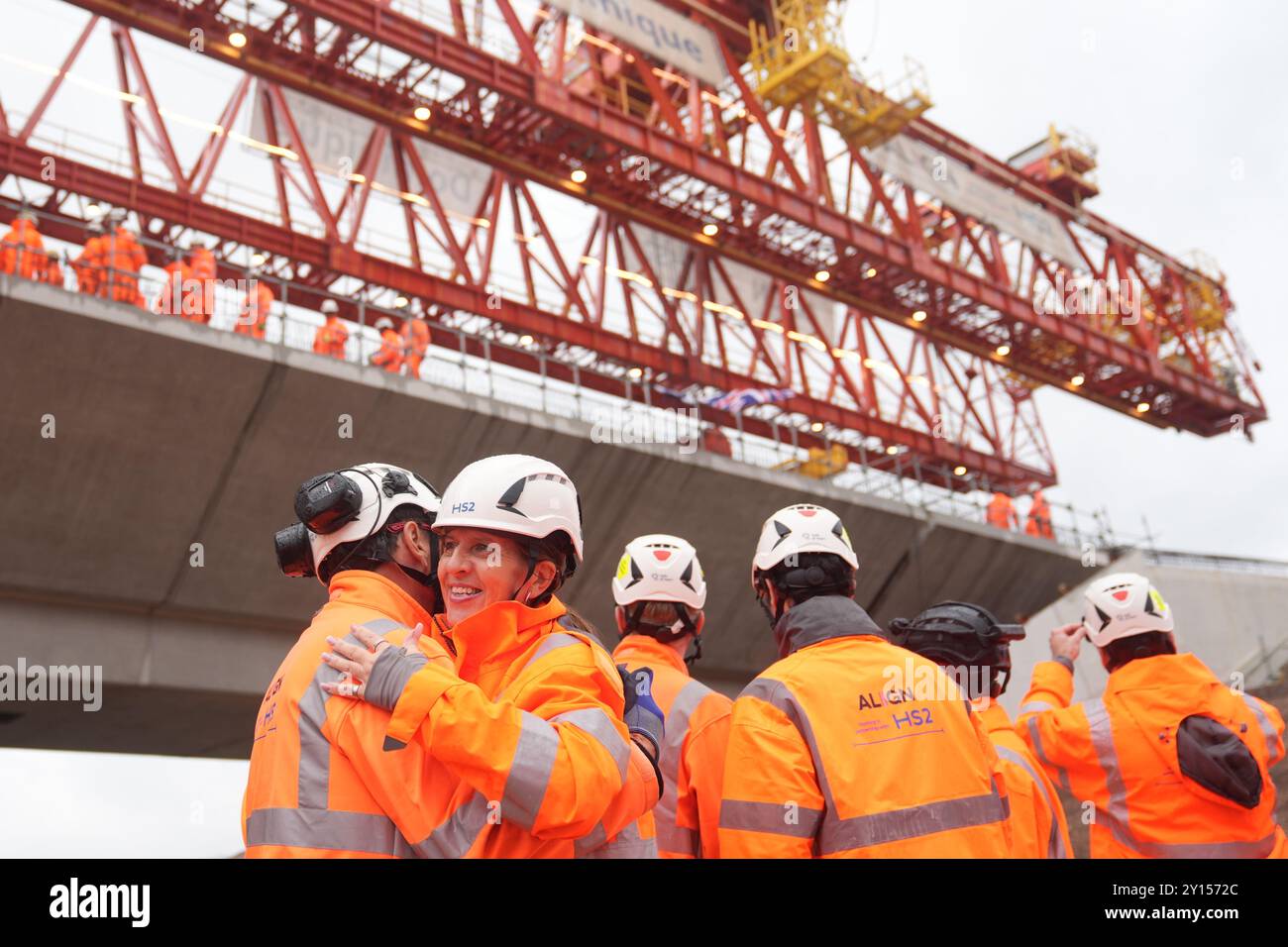 Workers celebrate as the final deck segment of HS2's 2.1-mile long ...