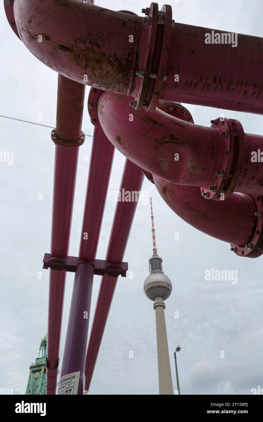 Germany, Berlin, Mitte, elevated red pipes removing water from ...