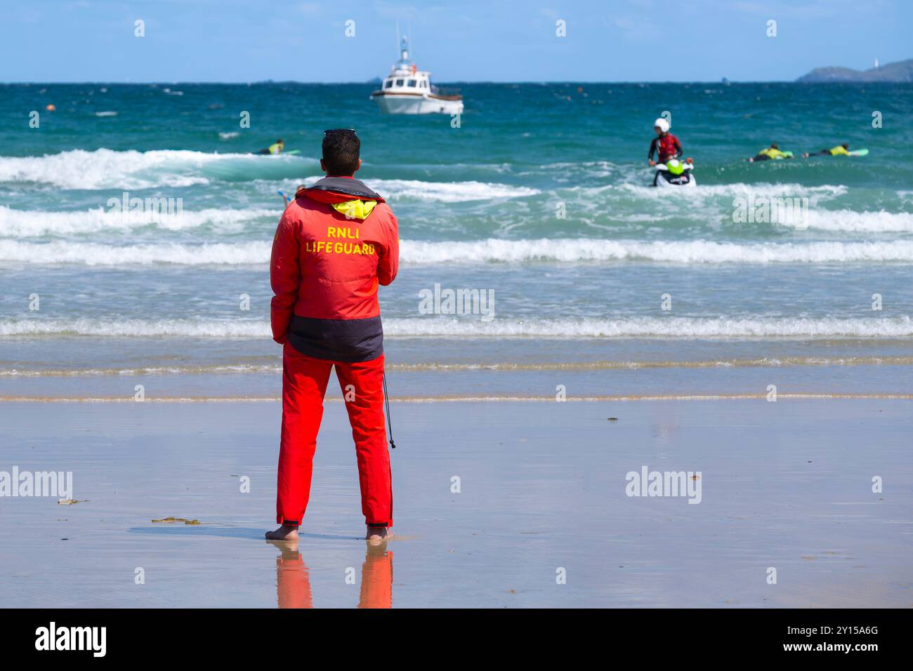 RNLI Royal National Lifeboat Institution Lifeguard Lifeguards on duty at Towan Beach in Newquay ...