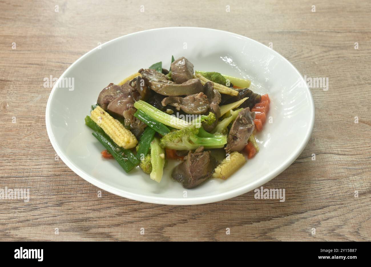 stir fried mixed vegetable with chicken liver and gizzard on plate ...