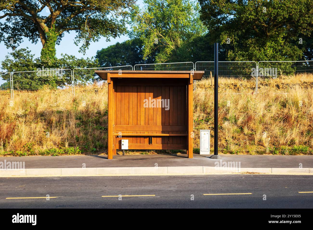 New built wooden bus stop in england uk Stock Photo - Alamy