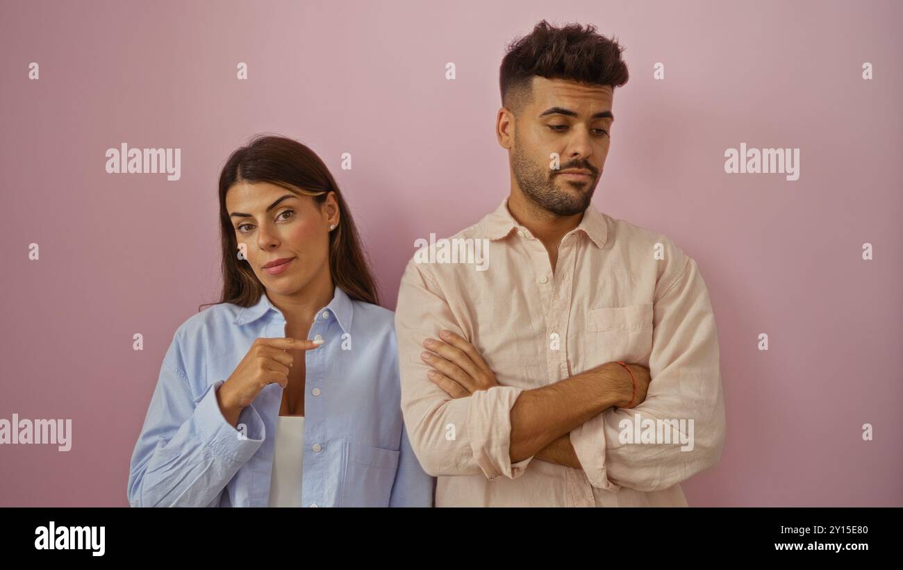 Couple standing isolated on pink background depicting relationship ...