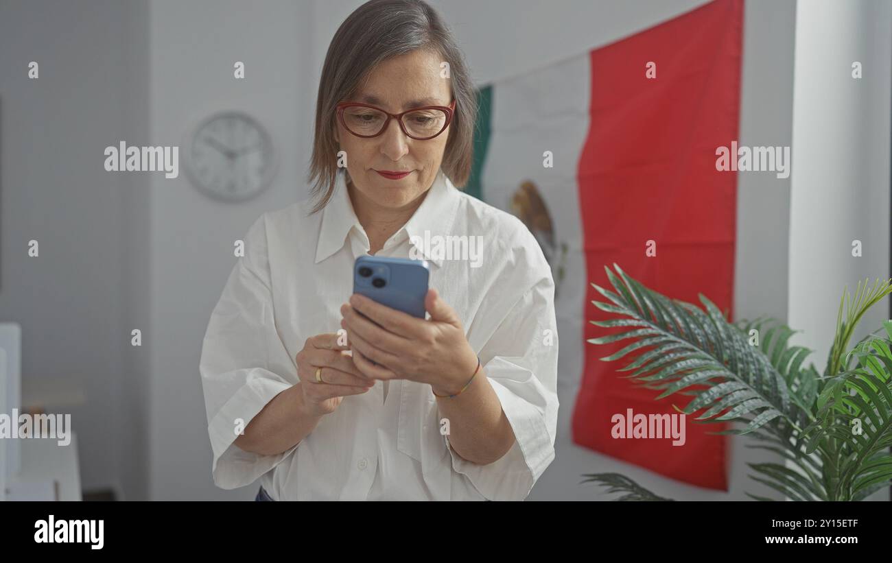 A middle-aged woman checks her smartphone in a room adorned with a ...