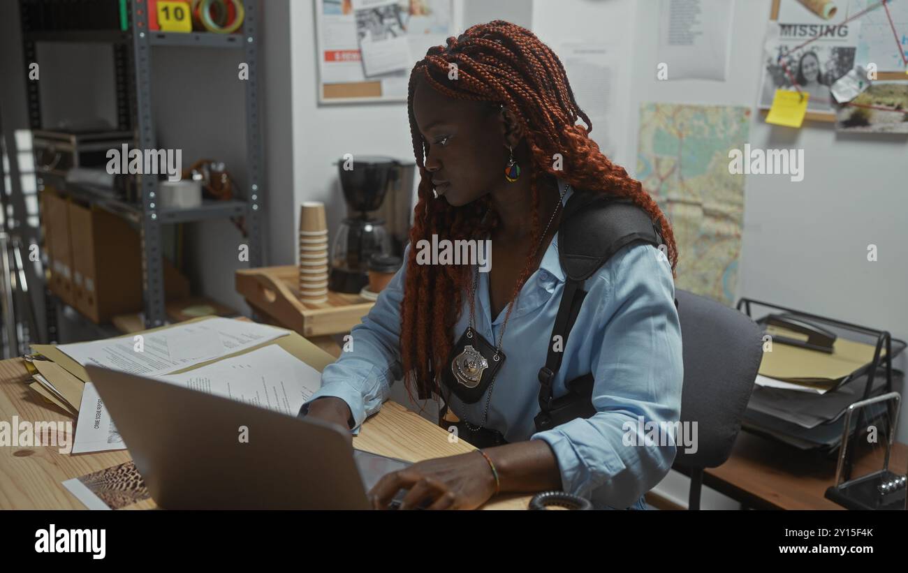 African american woman detective concentrating on work at police ...