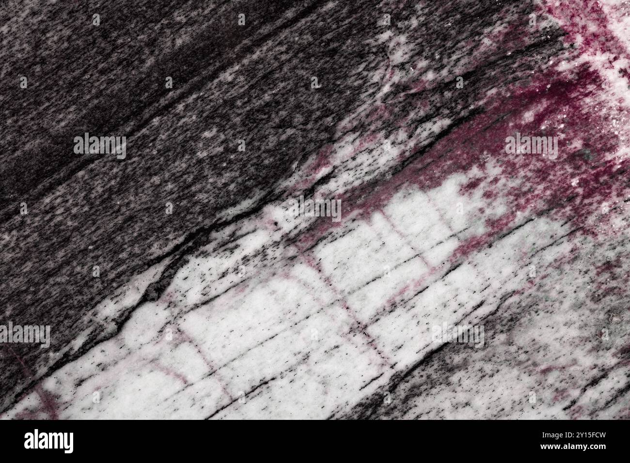 Close-up texture of natural granite with a mix of black, white, and ...