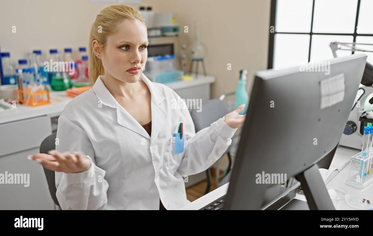 Skeptical young blonde scientist in hi-res stock photography and images ...