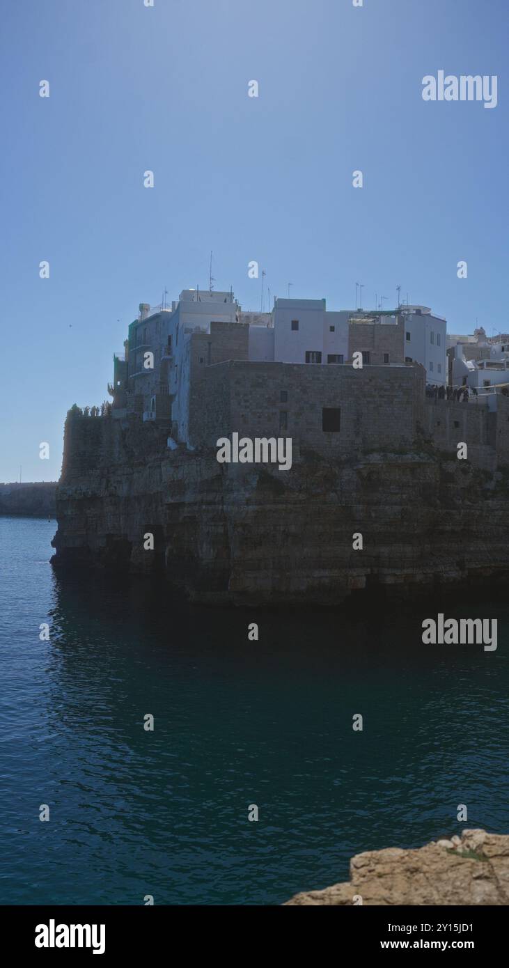 Polignano a mare offers stunning cliffs and ancient buildings perched ...