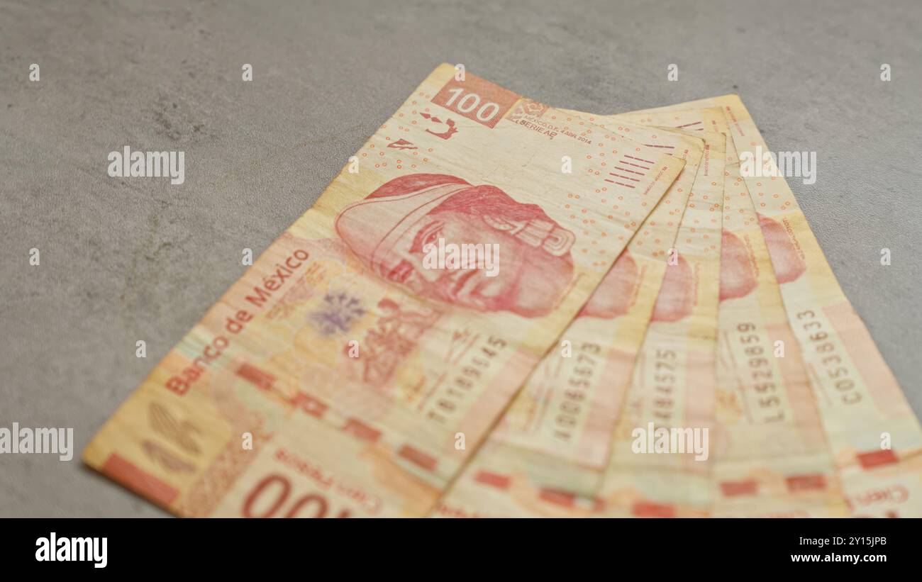 Mexican pesos banknotes on a concrete surface highlighting currency ...