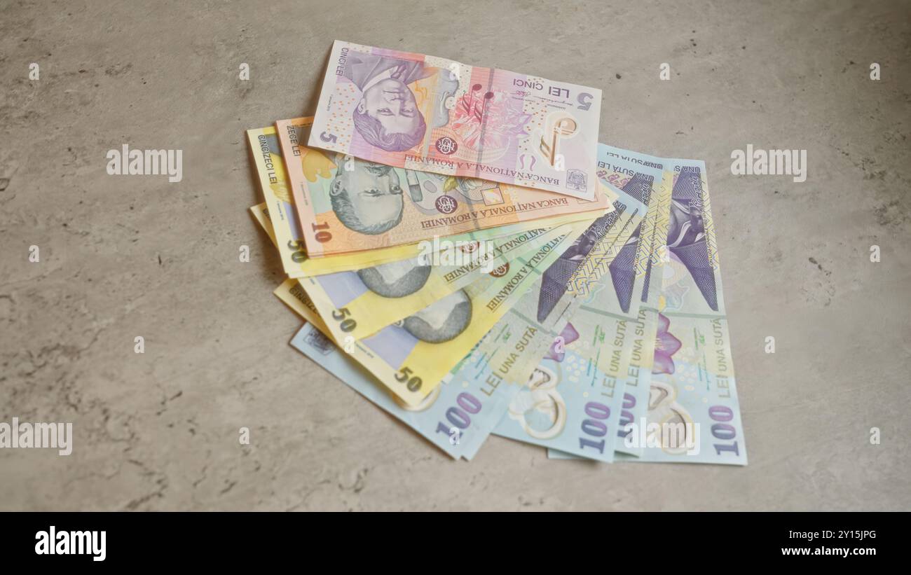 Romanian banknotes displaying various denominations of leu currency are ...