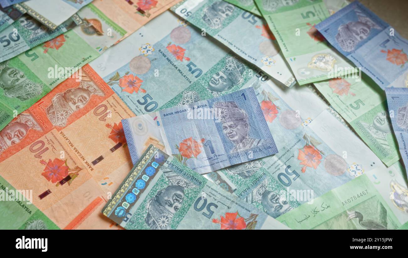 Malaysian ringgit banknotes in various denominations scattered ...