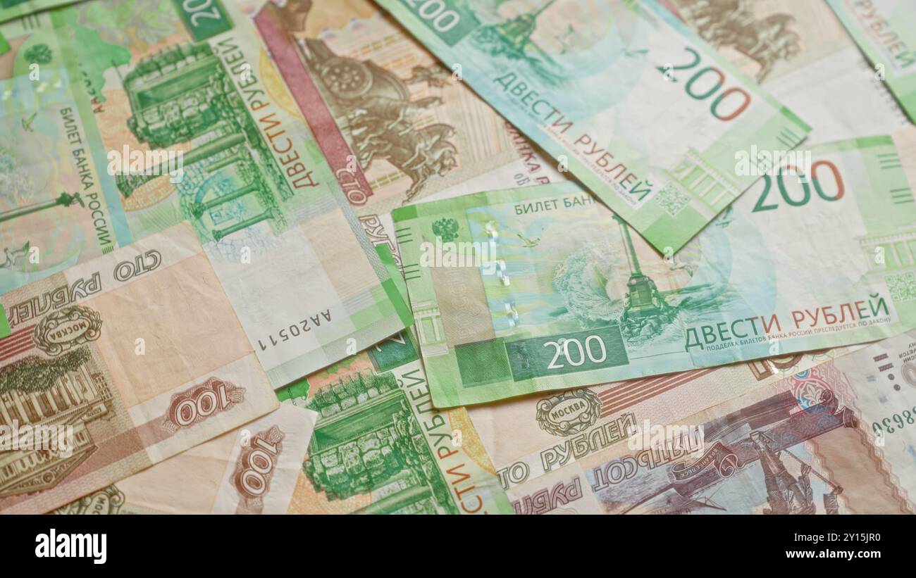 Russian ruble banknotes displayed closely together showcasing various ...