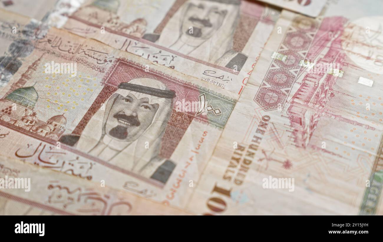 Close-up of saudi arabian riyal banknotes featuring intricate designs ...