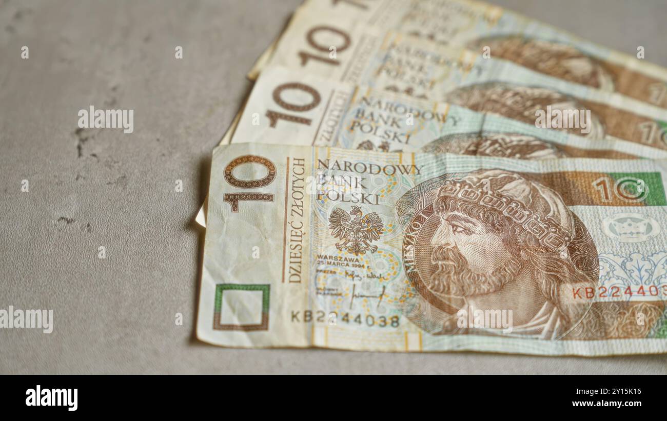 Polish zloty banknotes on a concrete surface displaying narodowy bank ...