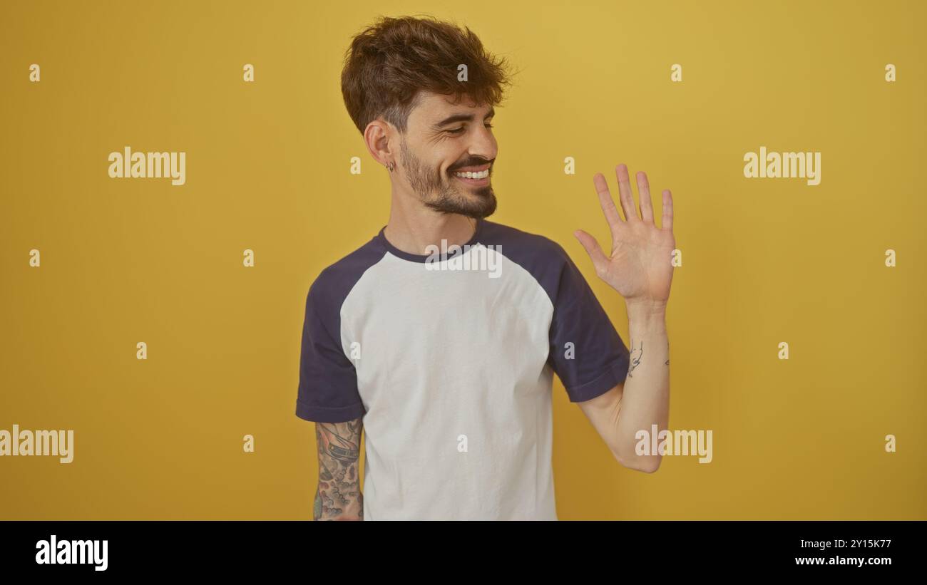 Handsome young man with a beard showing the number five with his hand ...