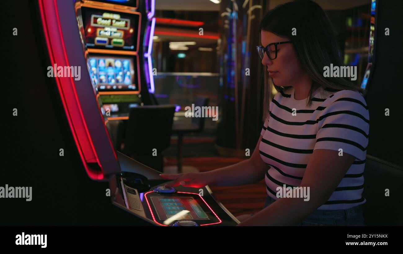 Woman playing arcade machine hi-res stock photography and images - Alamy