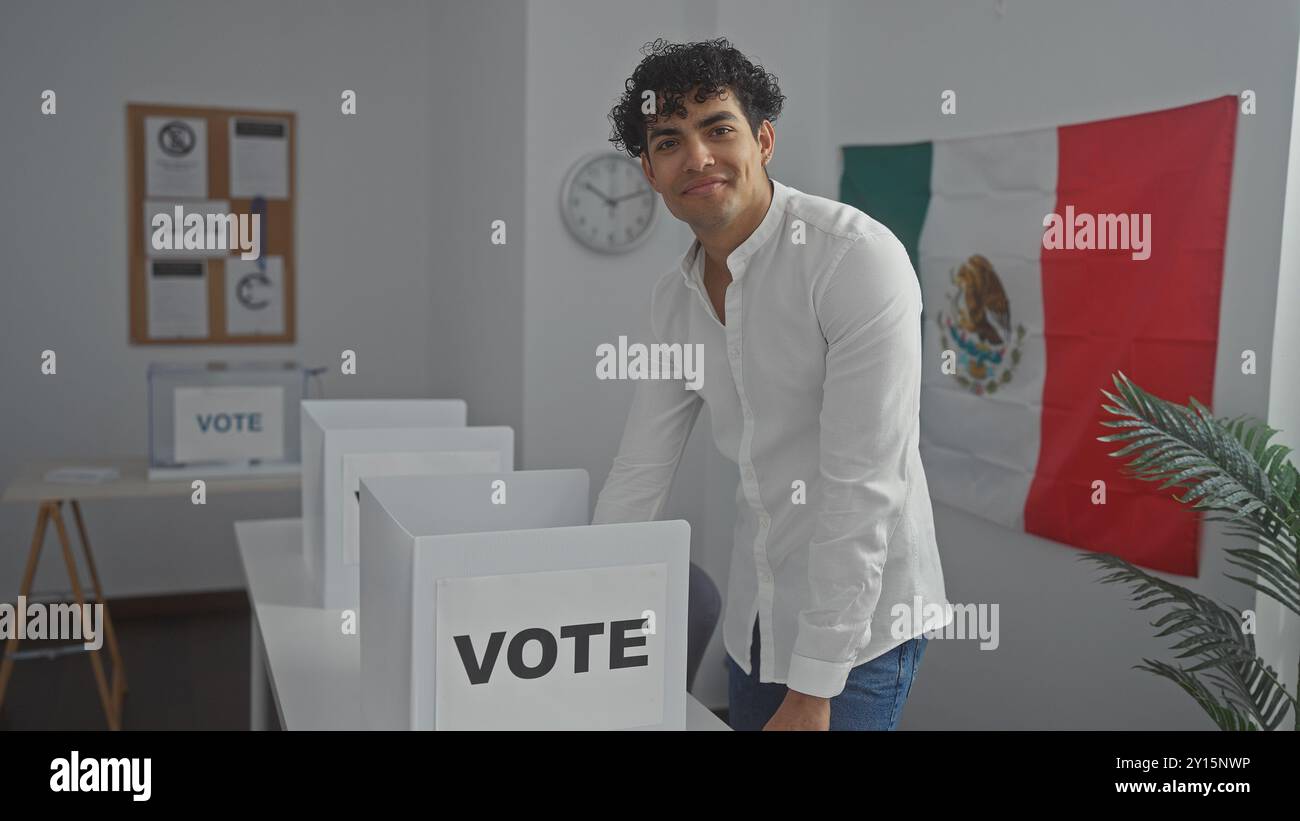 A young mexican man smiling in a voting booth with a flag of mexico in ...