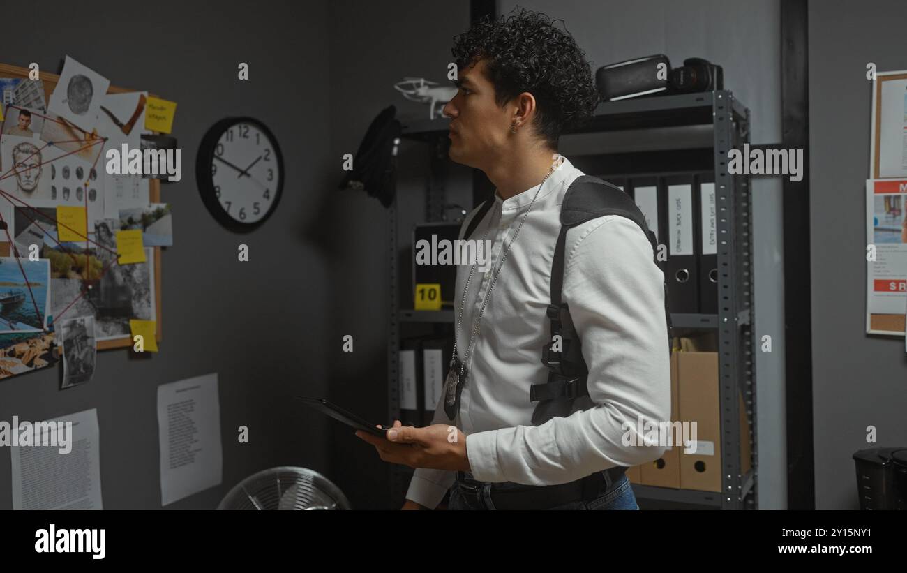 Hispanic detective man analyzing evidence indoors at police station's ...