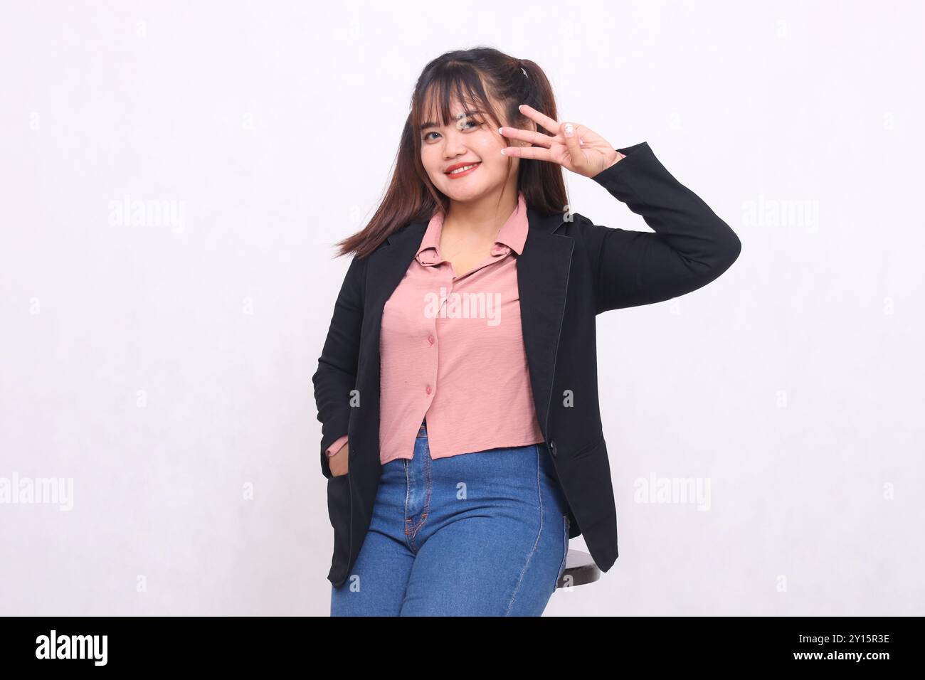 Beautiful Asian businesswoman in suit standing smiling hand pointing ...
