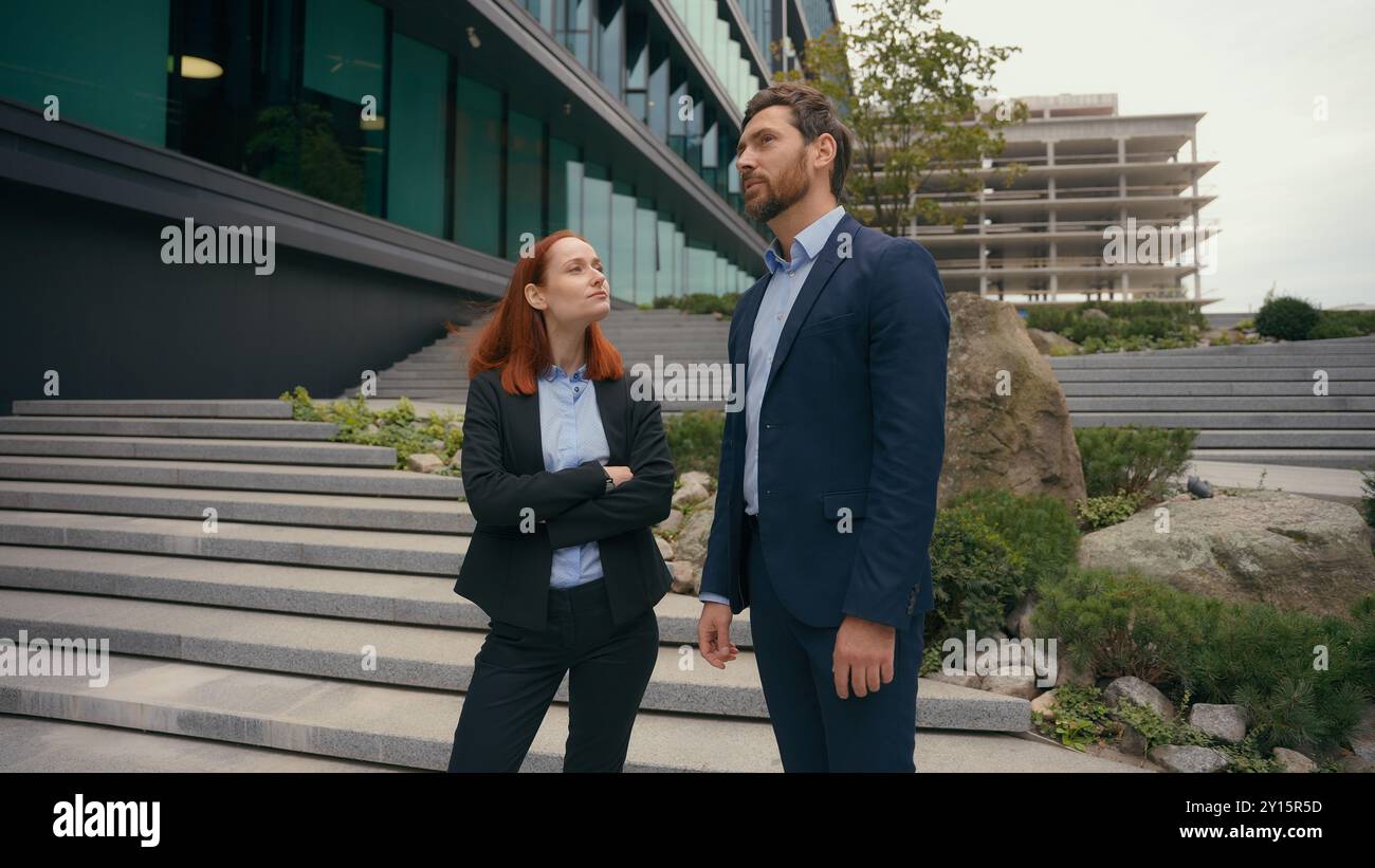 Caucasian middle-aged businesswoman and adult woman business coworkers ...