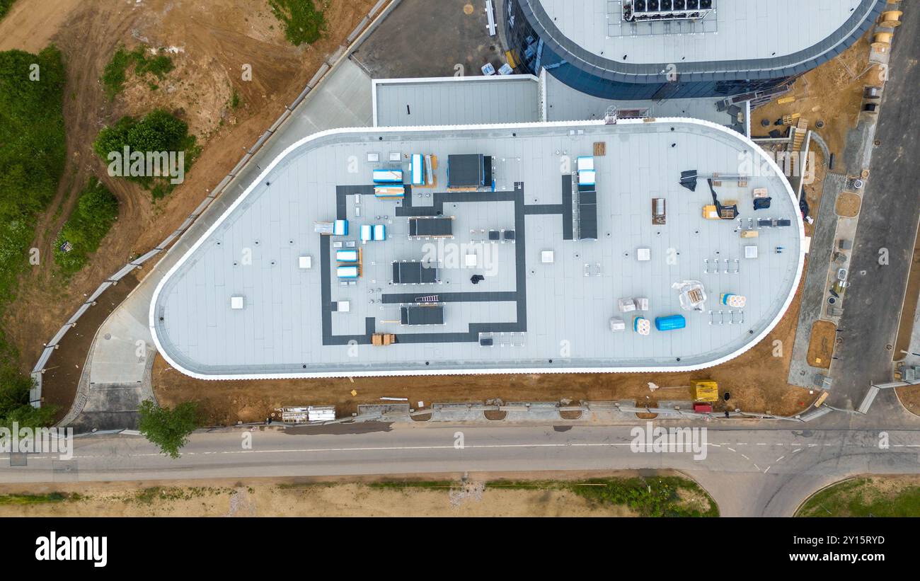 Aerial view of a commercial building rooftop featuring various HVAC ...