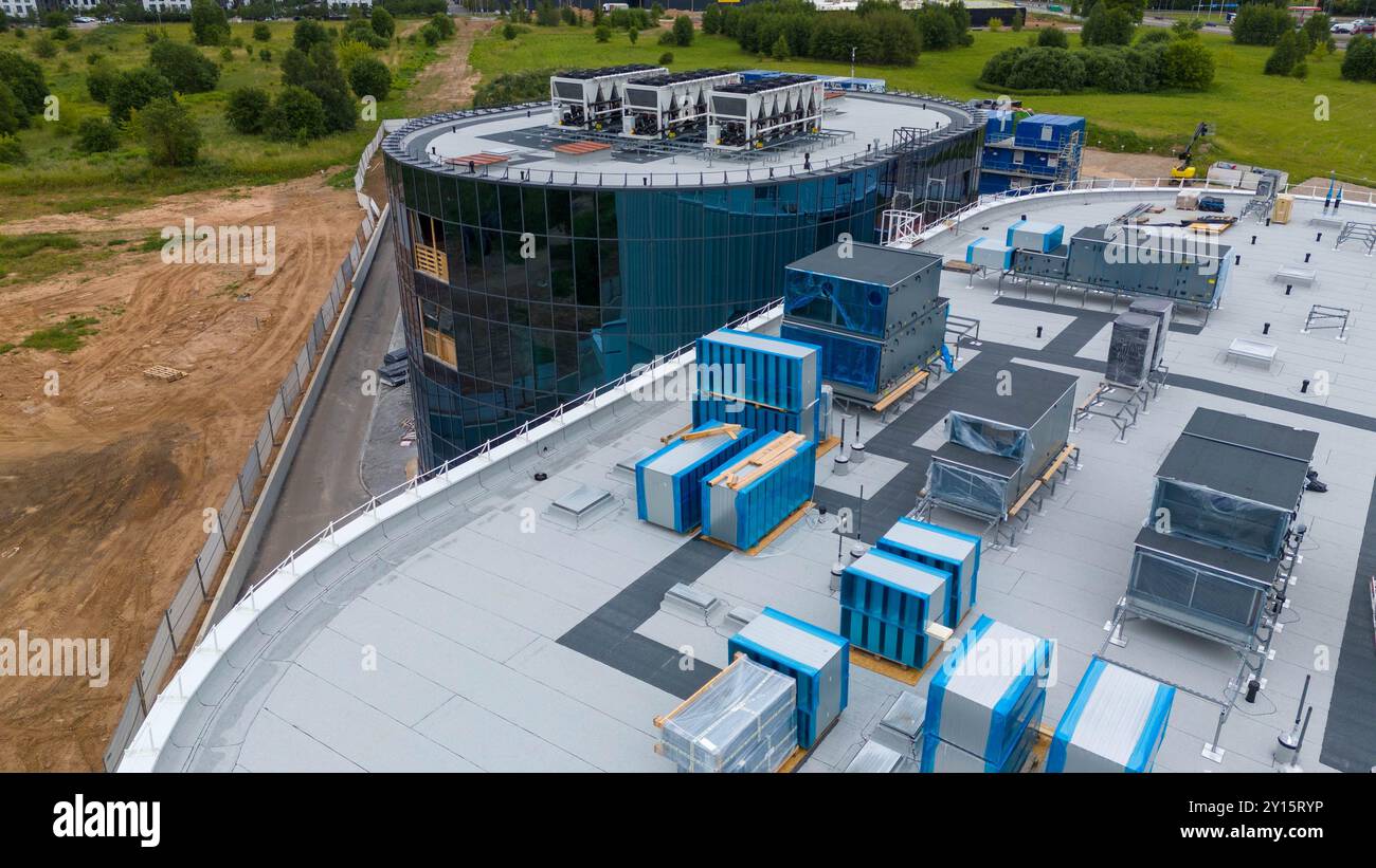 Aerial view of a commercial building rooftop featuring various HVAC ...