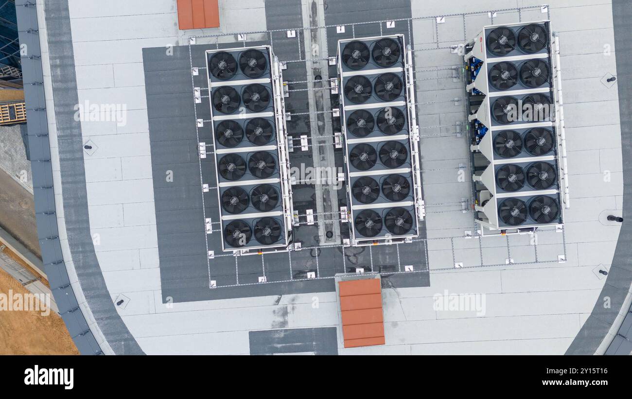 Aerial view of a commercial building rooftop featuring various HVAC ...