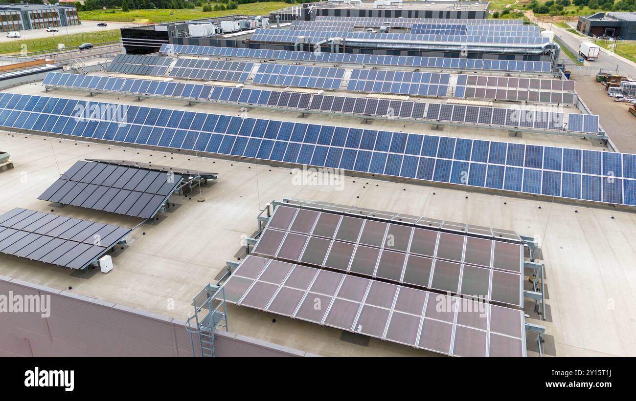 Aerial view of a modern industrial building with solar panels on the ...