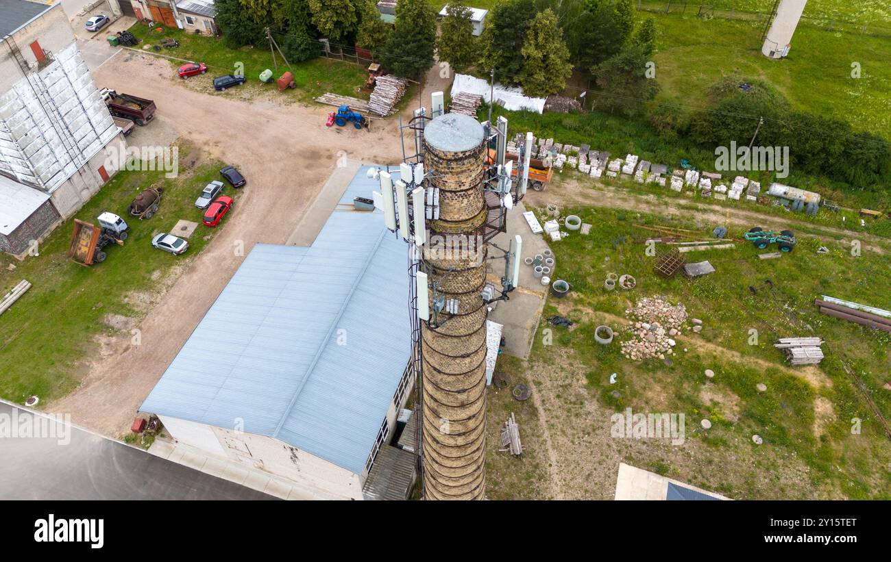 Aerial view of a tall industrial chimney surrounded by various ...