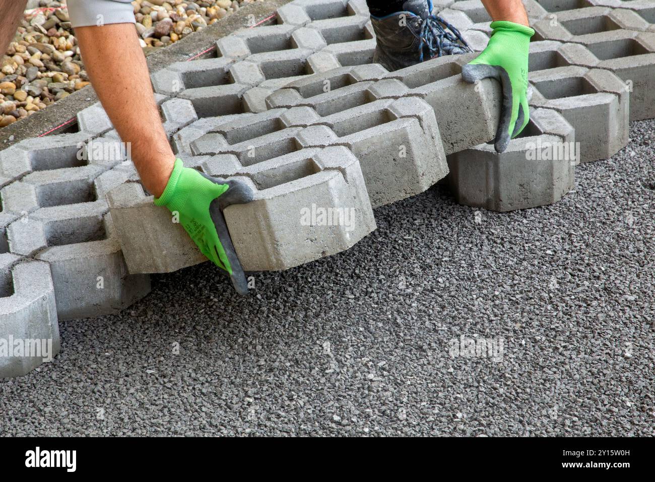 Paving work: Laying of grass pavers Stock Photo - Alamy