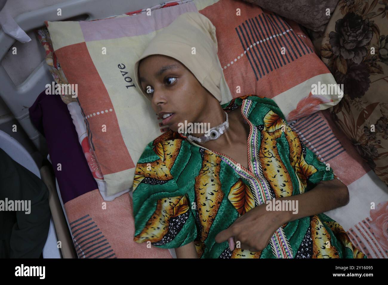 Palestinian girl Bashayer Al-Abeed 17 years old lies on the bed ...