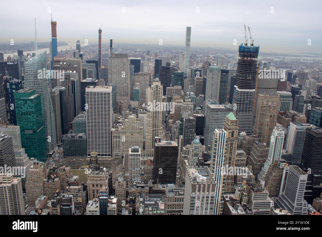 Aerial view of Manhattan in New York City showing the classic high rise buildings and city scape ...