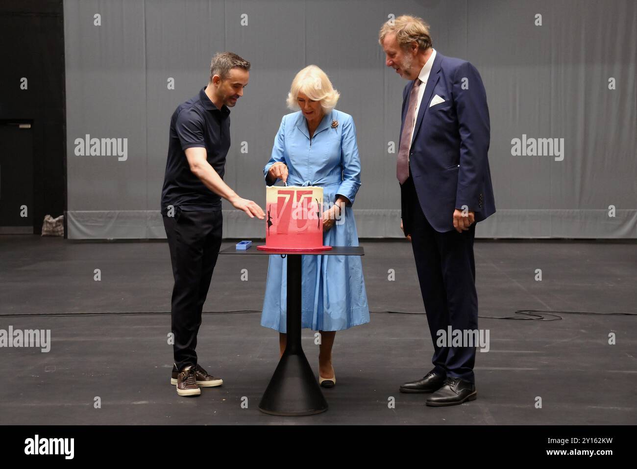 Queen Camilla, Patron of English National Ballet, cuts a cake to ...