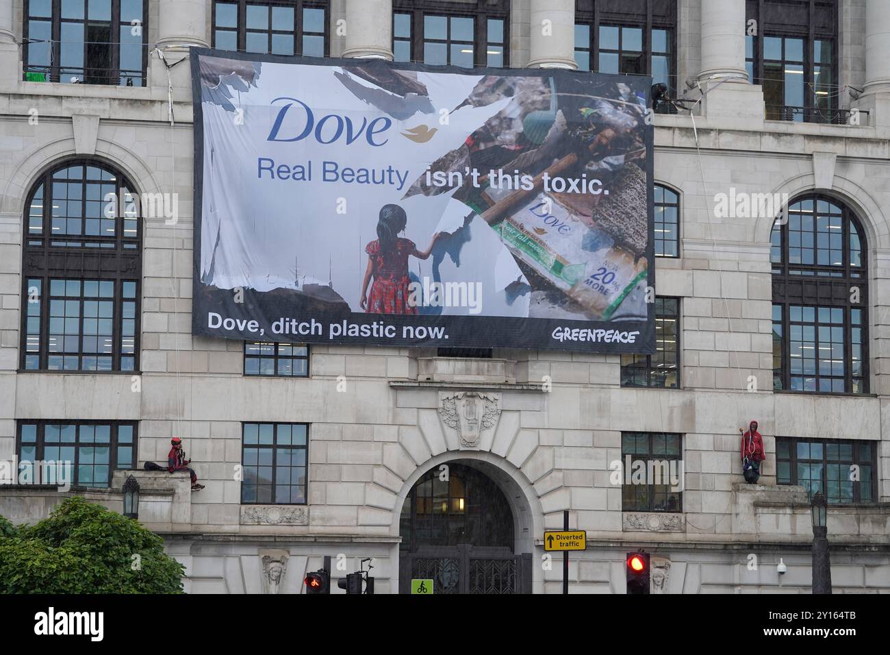 Activists outside Unilever's headquarters in central London as ...