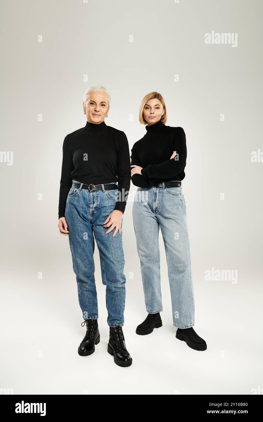 Two women share a joyful moment, showcasing their stylish outfits Stock ...