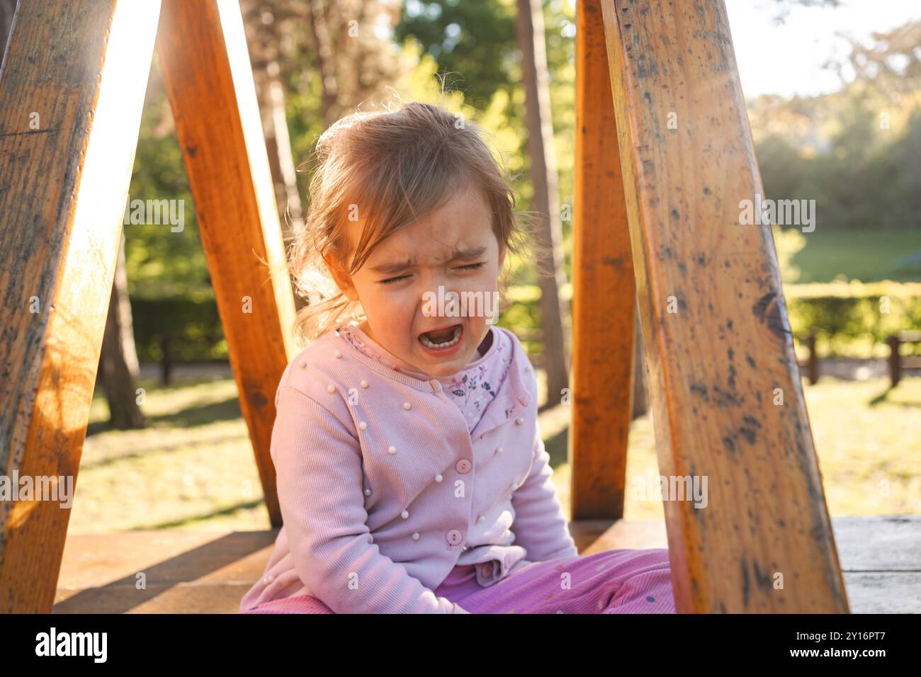 Little girl crying on the playground in the playground Stock Photo - Alamy
