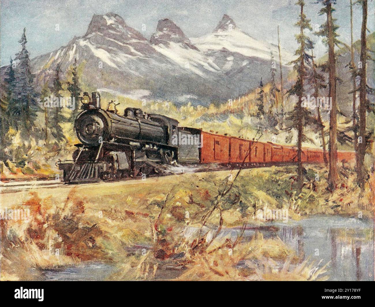 In Canadian Rockies, train going by the Three Sisters Mountain in ...