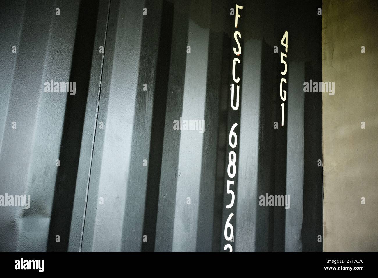 A wall with an industrial interior theme that uses black shipping ...