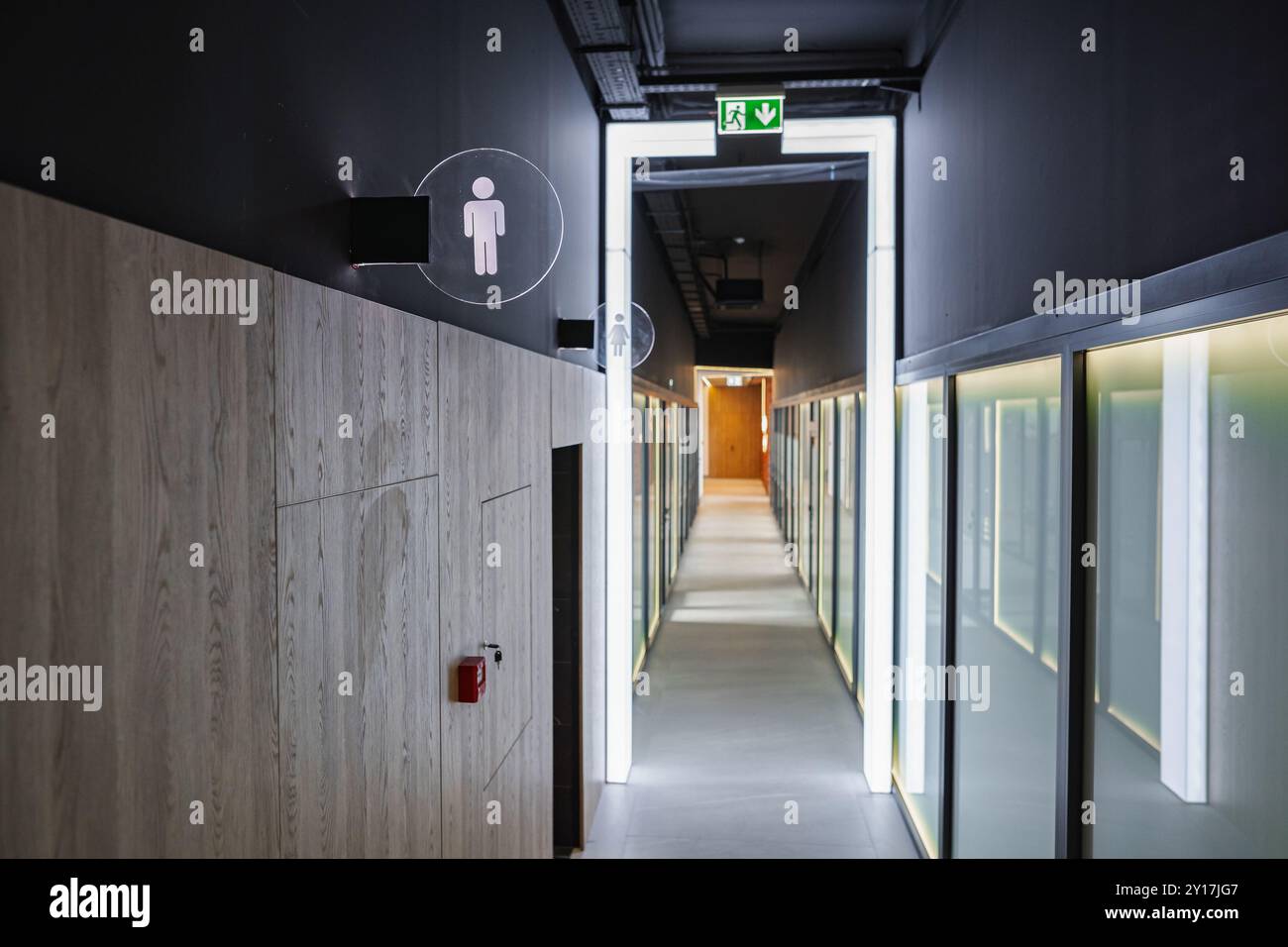 Long Hallway With Toilet Sign Stock Photo - Alamy