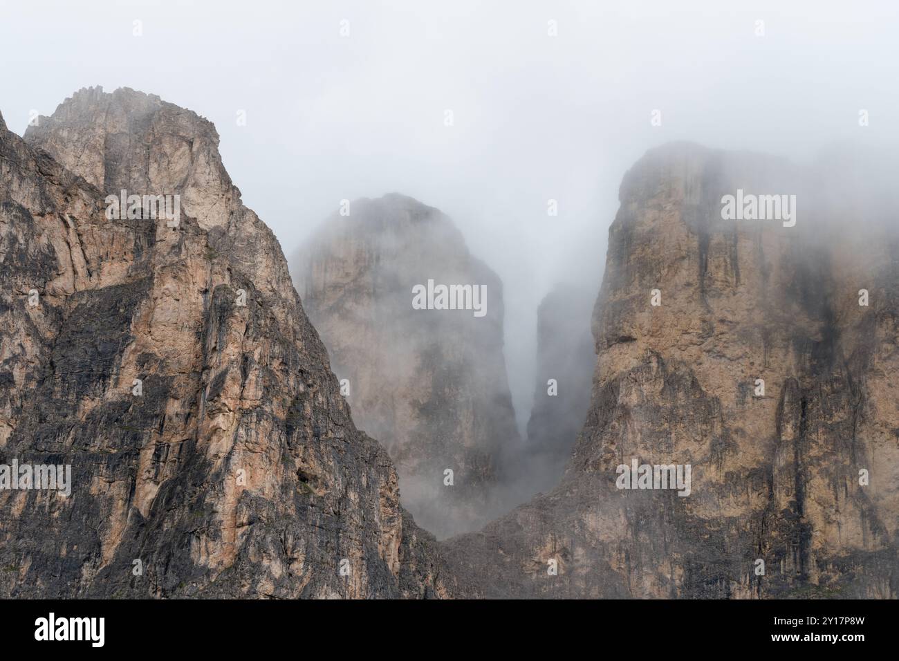 rocky mountain peaks in the clouds, sella towers, dolomites, italian ...